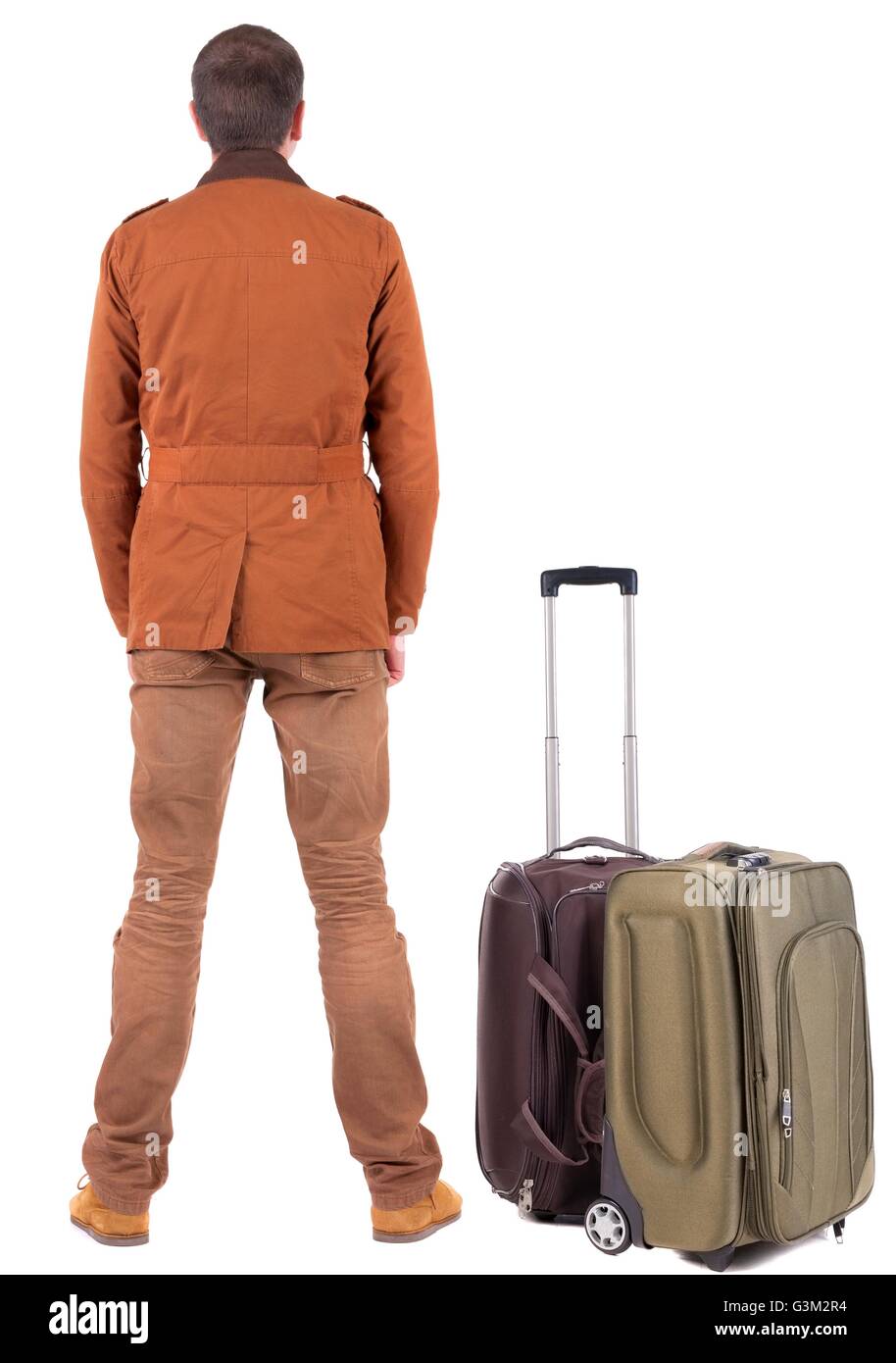 Back view of traveling busness man with suitcase looking up. Standing ...