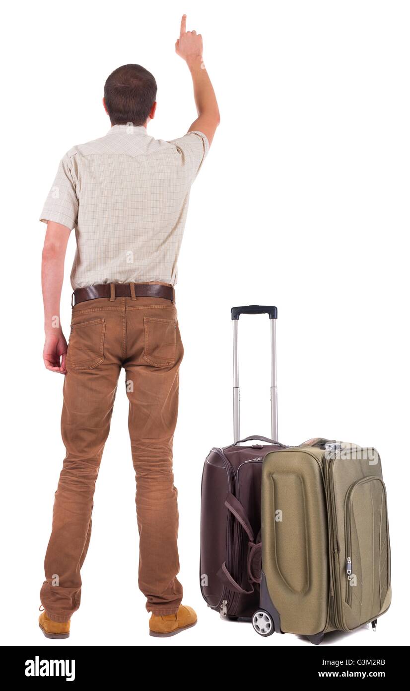Back view of traveling busness man with suitcase looking up. Standing ...
