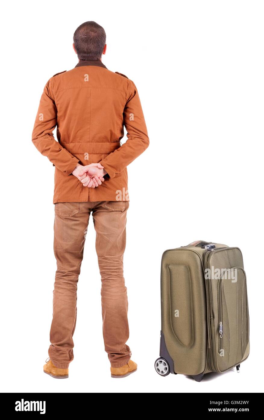 Back view of traveling busness man with suitcase looking up. Standing ...