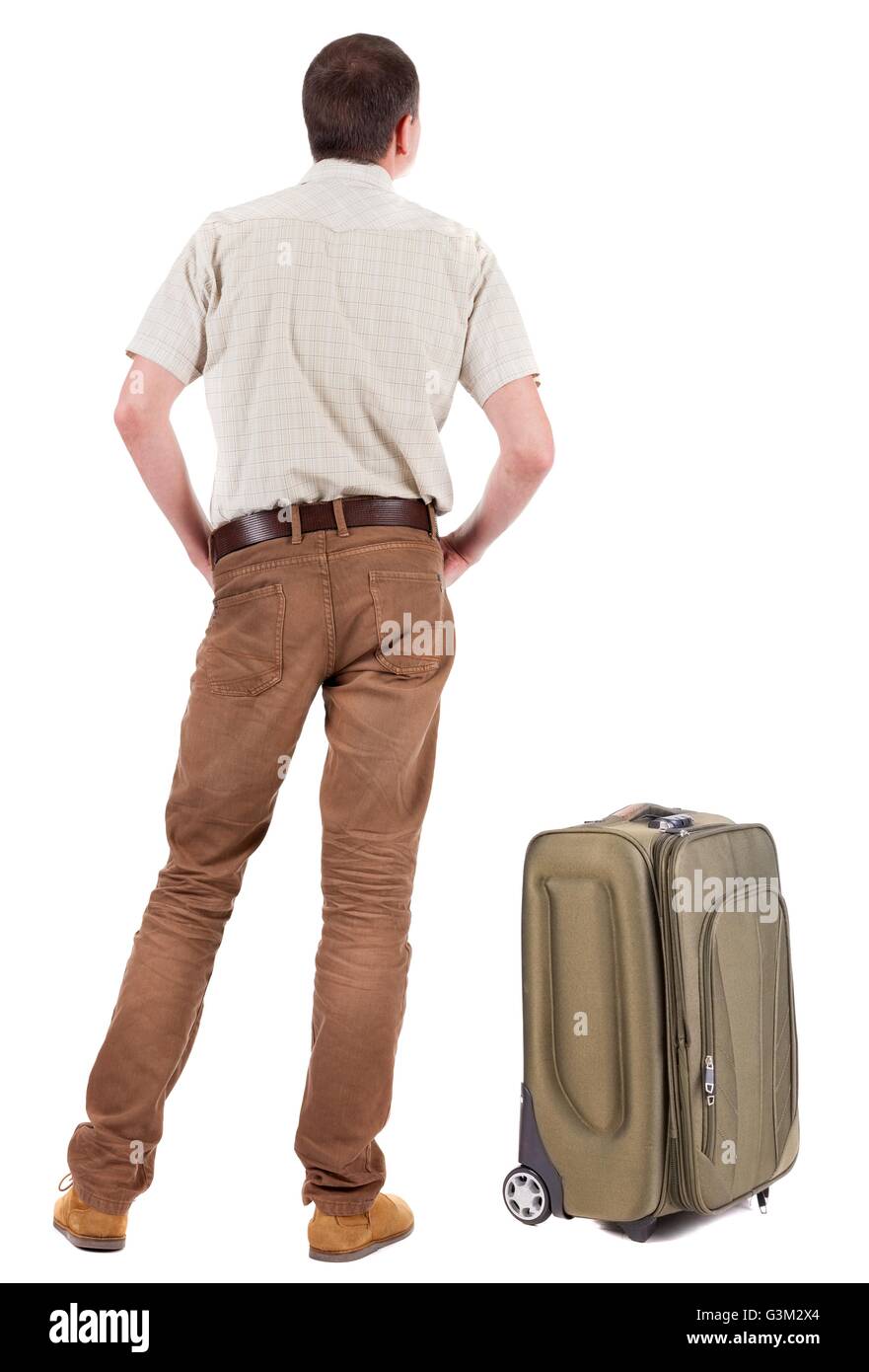 Back view of traveling busness man with suitcase looking up. Standing ...
