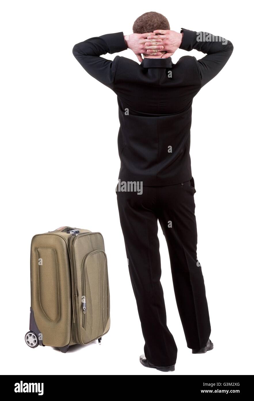 Back view of traveling busness man with suitcase looking up. Standing ...