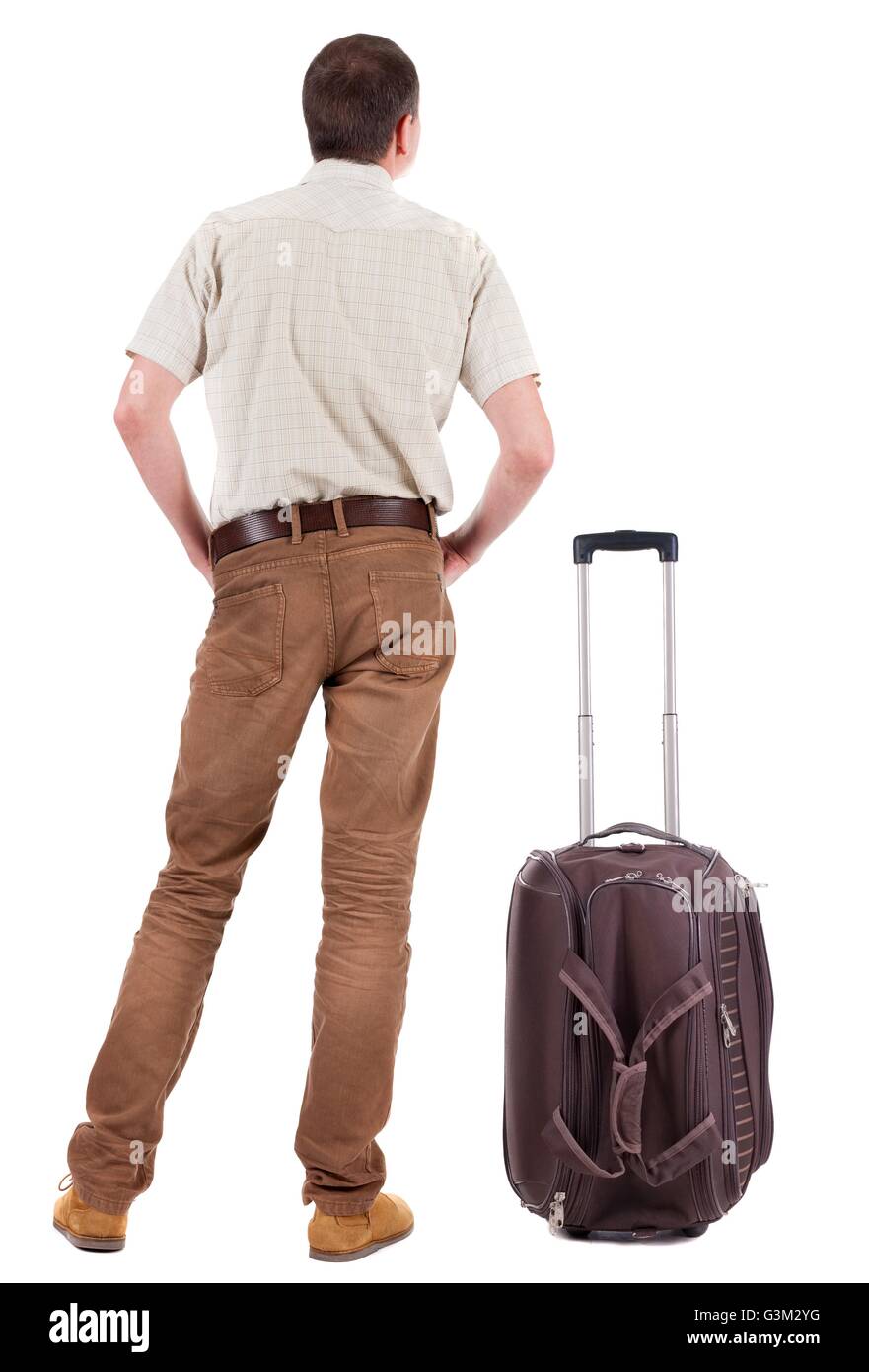 Back view of traveling busness man with suitcase looking up. Standing ...
