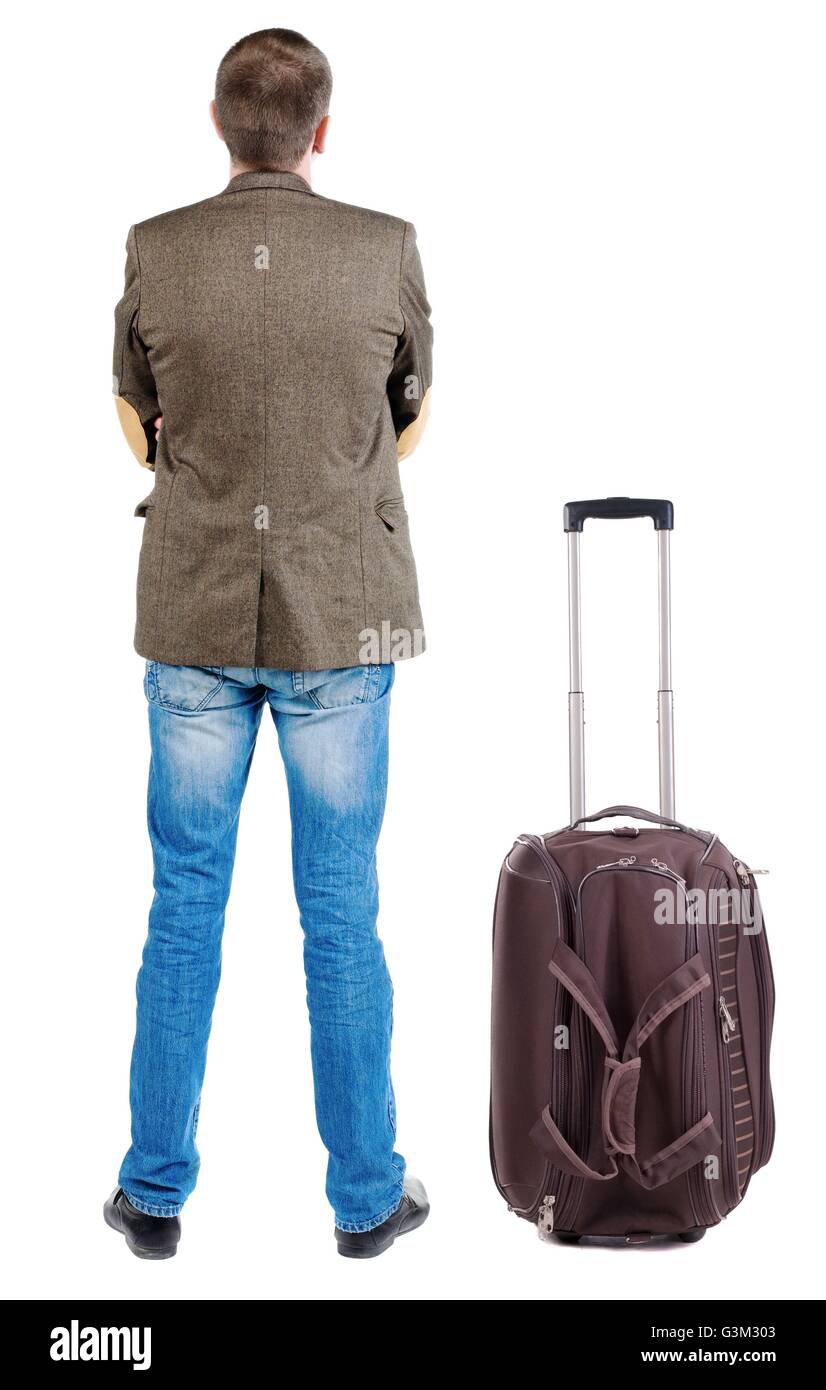 Back view of traveling busness man with suitcase looking up. Standing ...