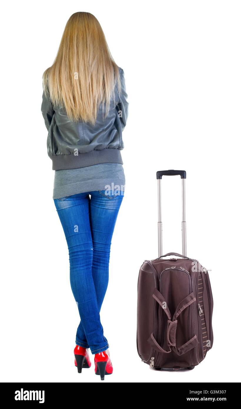 Back view of blonde woman with suitcase looking up. Standing young girl ...