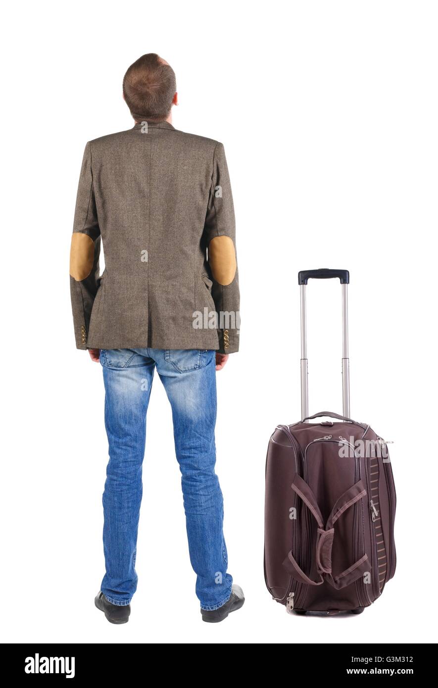Back view of traveling busness man with suitcase looking up. Standing ...