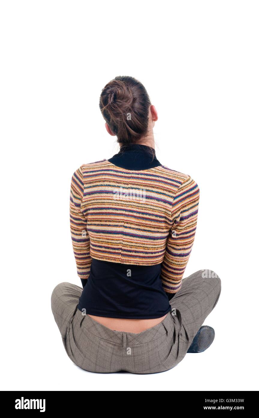 sitting young woman looks afar. Rear view. isolated over white Stock ...