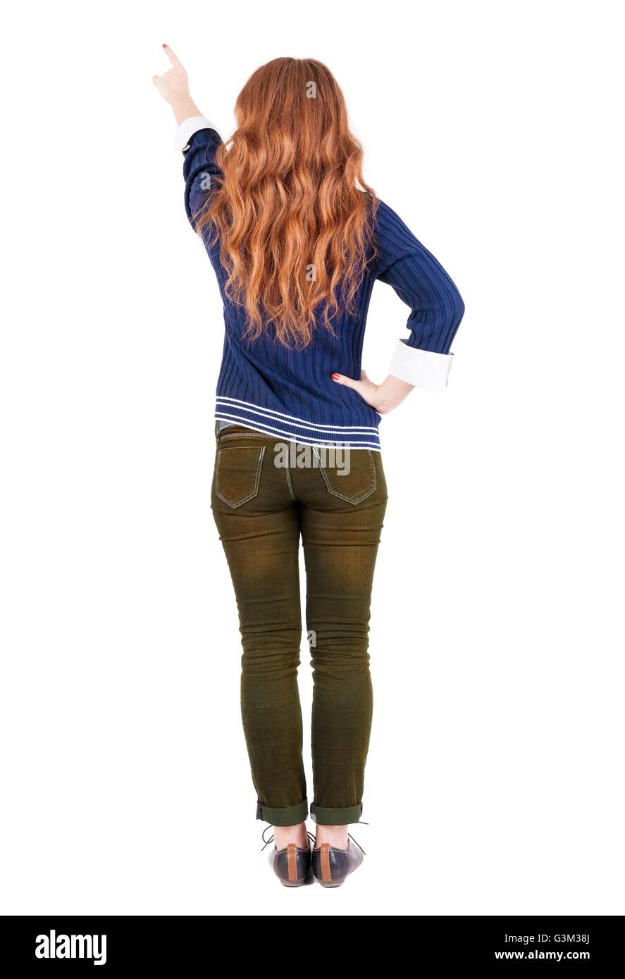 Back view of pointing woman. beautiful redhaired girl . girl shows ...