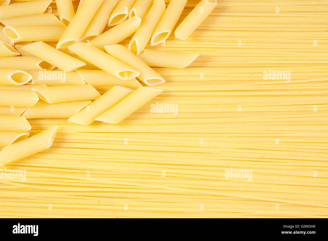 Background. Macaroni on long spaghetti. Close up Stock Photo - Alamy