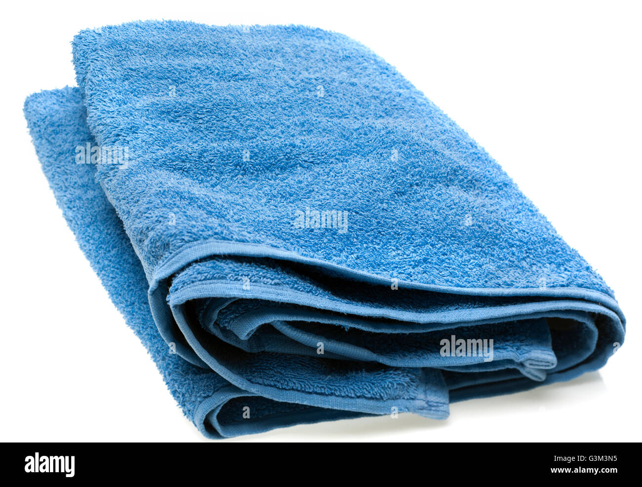 Blue folded towel Stock Photo - Alamy