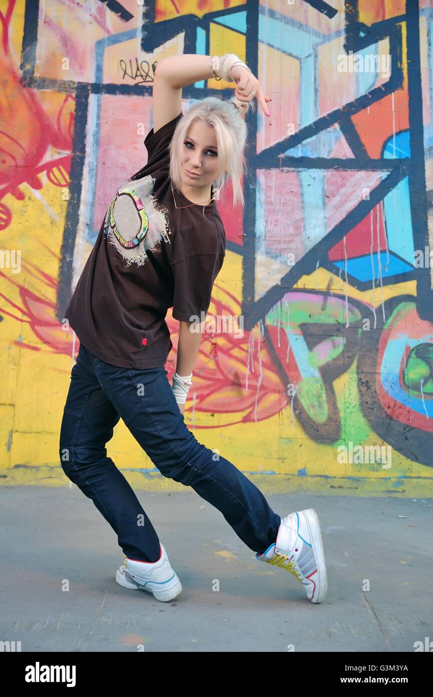Girl break-dancer posing Stock Photo - Alamy