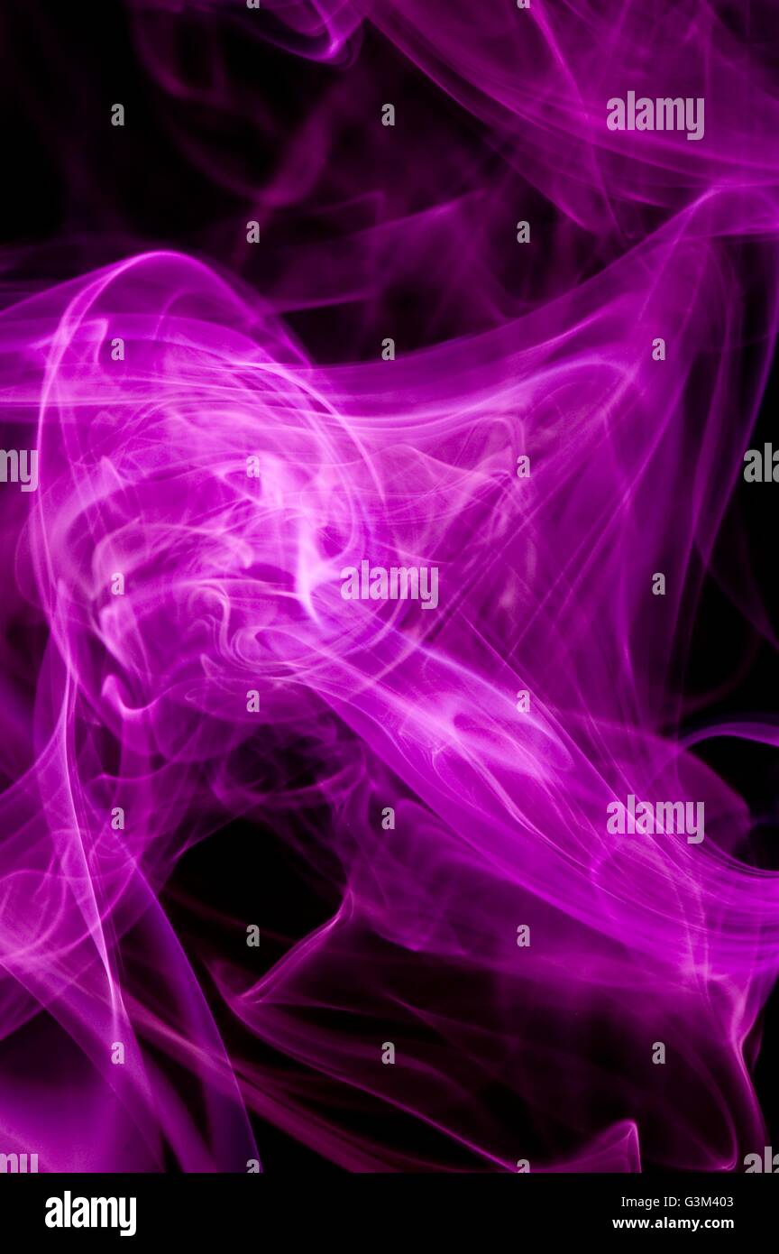 magenta smoke on black Stock Photo - Alamy