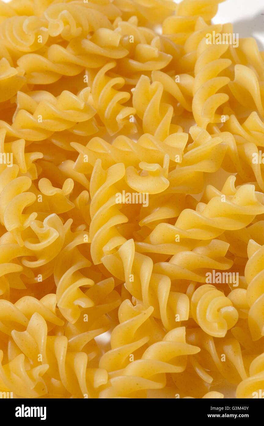 Yellow nice macaroni isolated on white background Stock Photo - Alamy