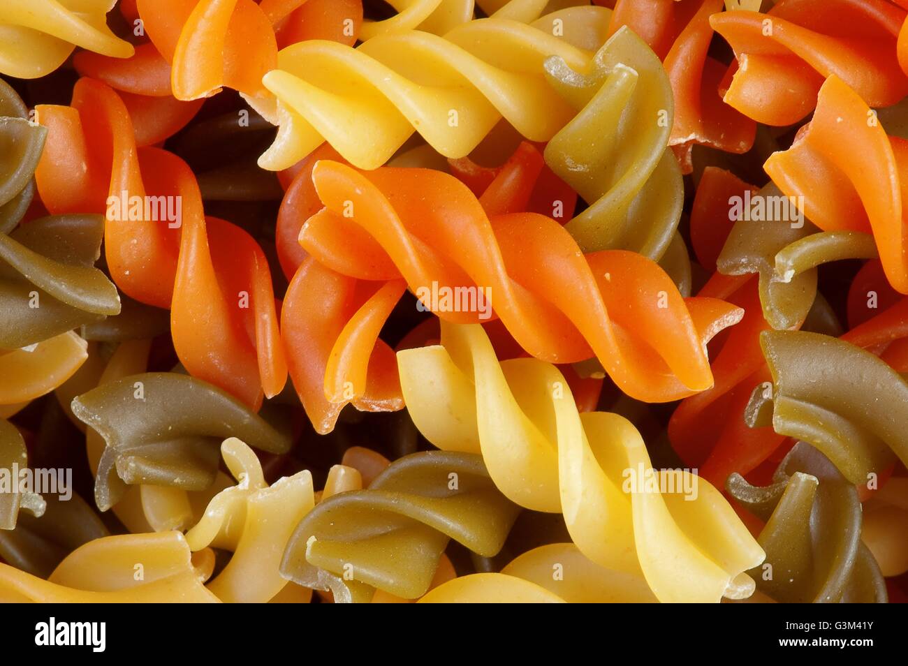 multicolor spiral macaroni. Close up Stock Photo - Alamy