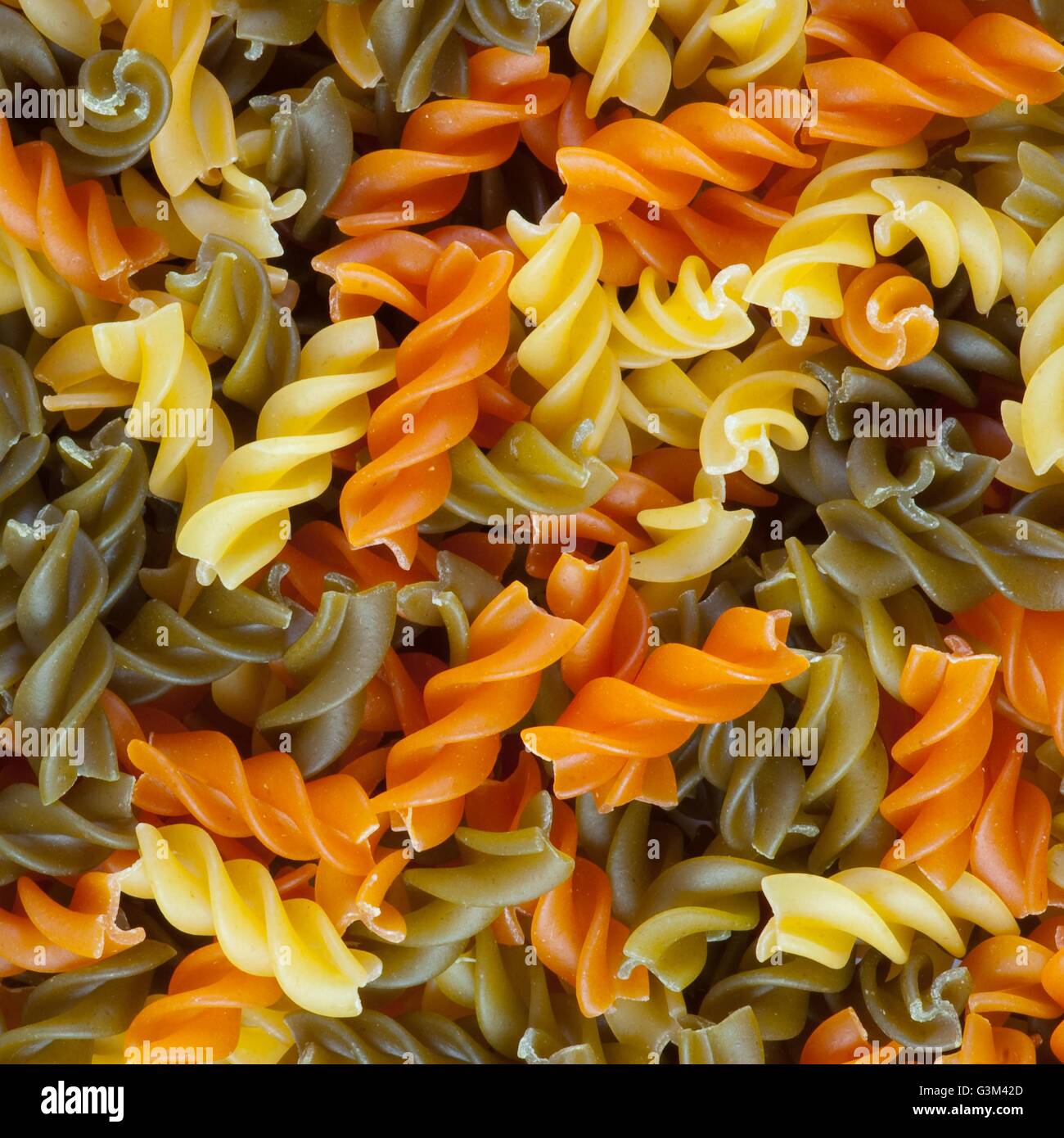 multicolor spiral macaroni. Close up Stock Photo - Alamy
