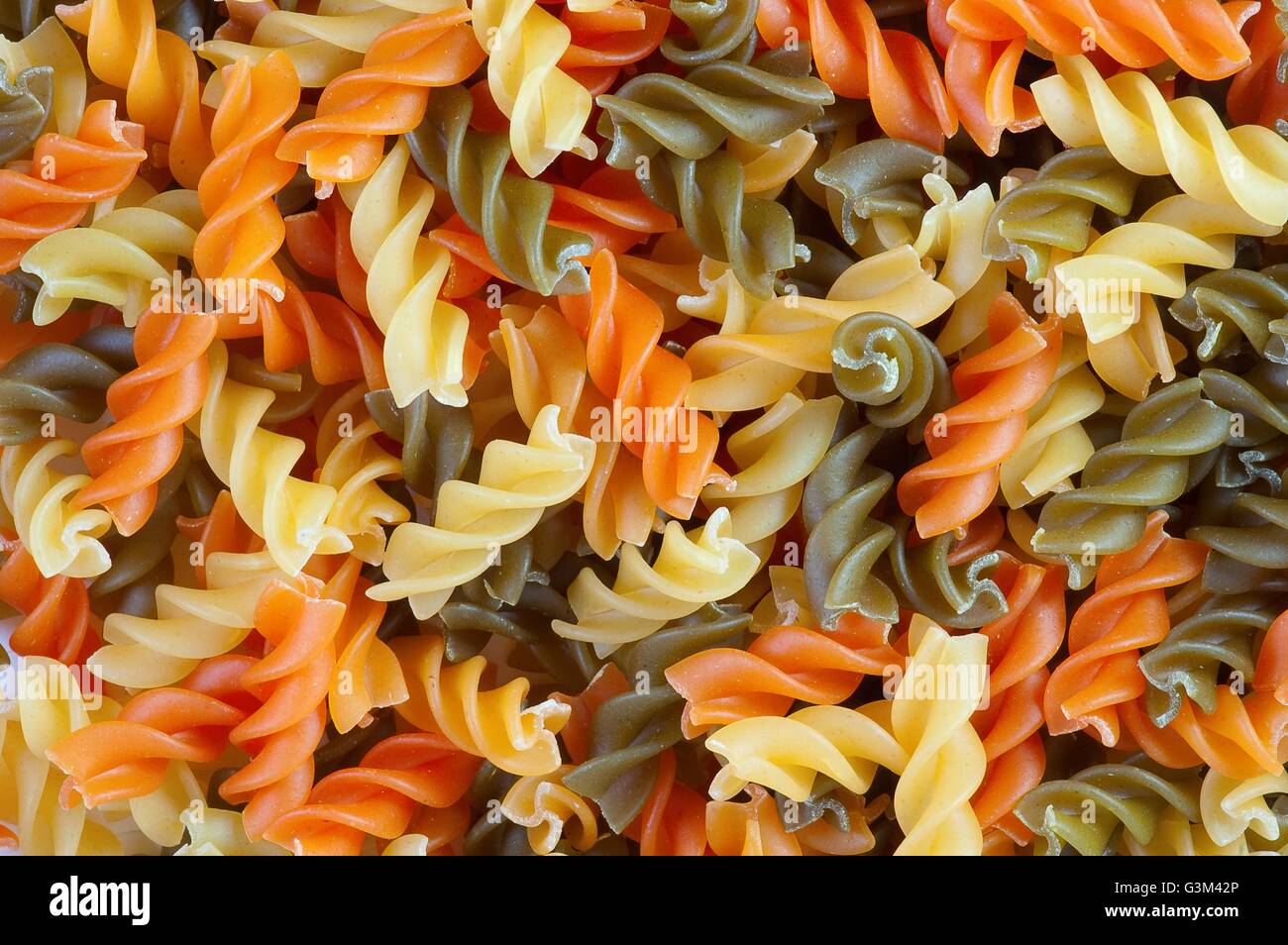 multicolor spiral macaroni. Close up Stock Photo - Alamy