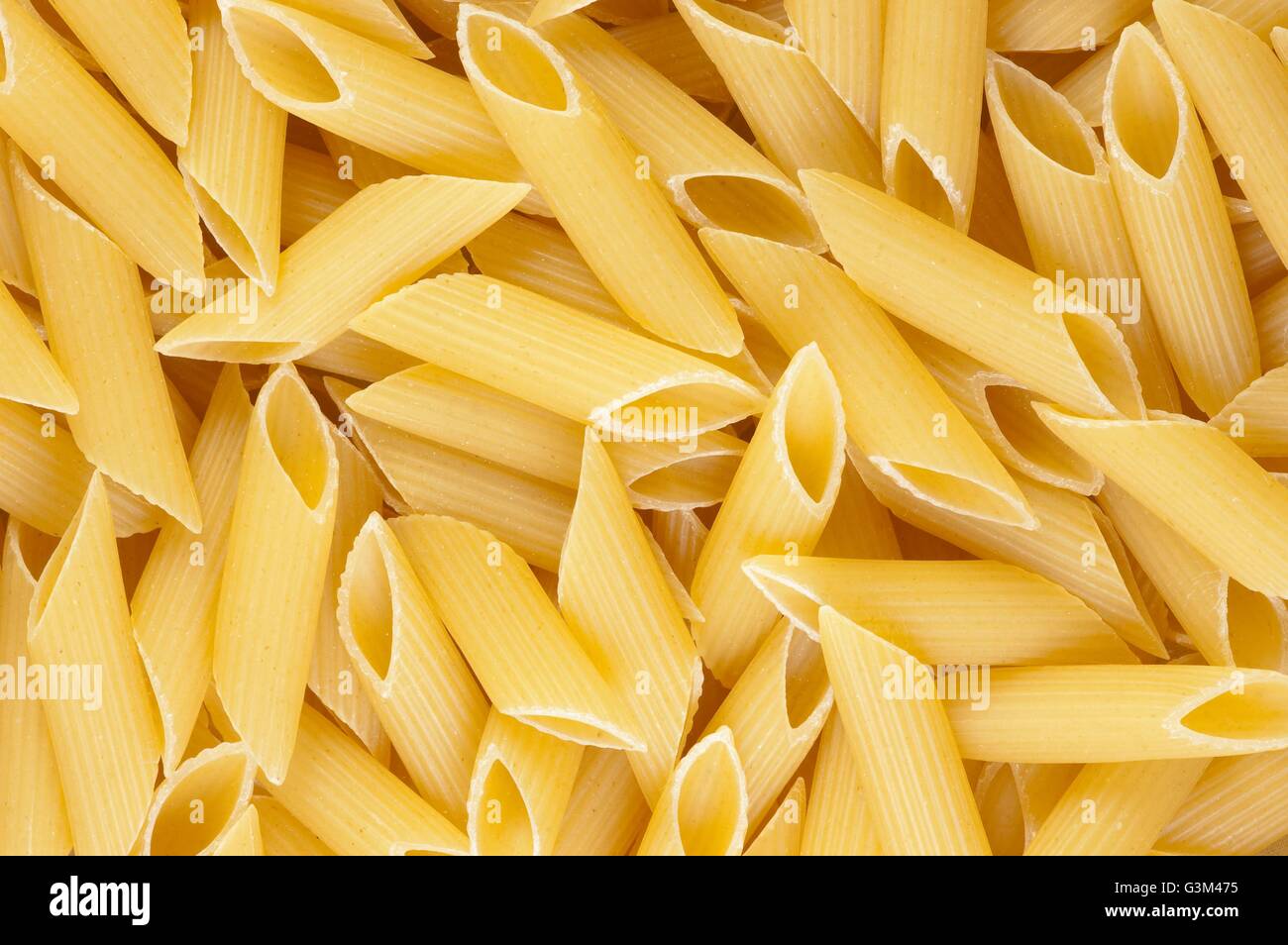 Yellow nice macaroni isolated on white background Stock Photo - Alamy