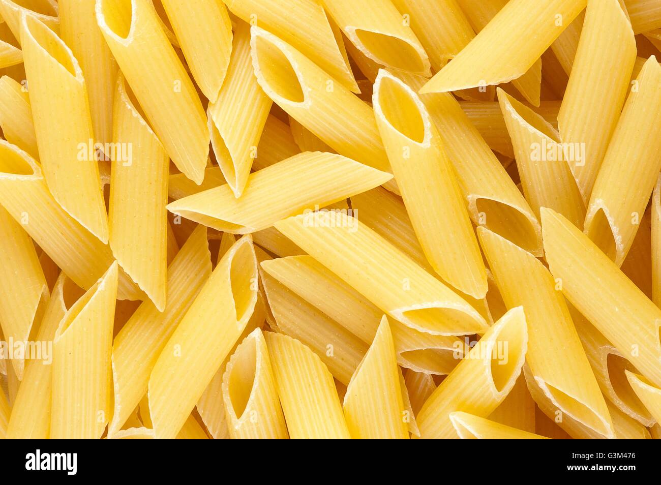 Yellow nice macaroni isolated on white background Stock Photo - Alamy