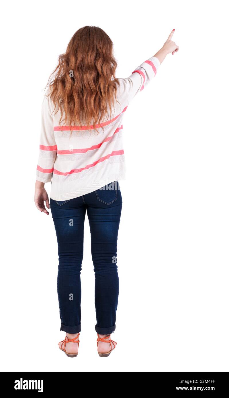 Back view of pointing woman. beautiful redhaired girl . girl shows ...