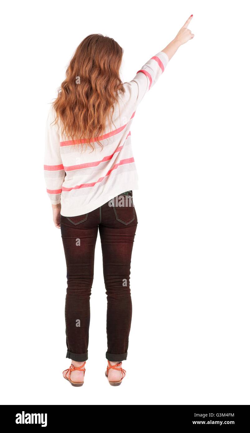 Back view of pointing woman. beautiful redhaired girl . girl shows ...