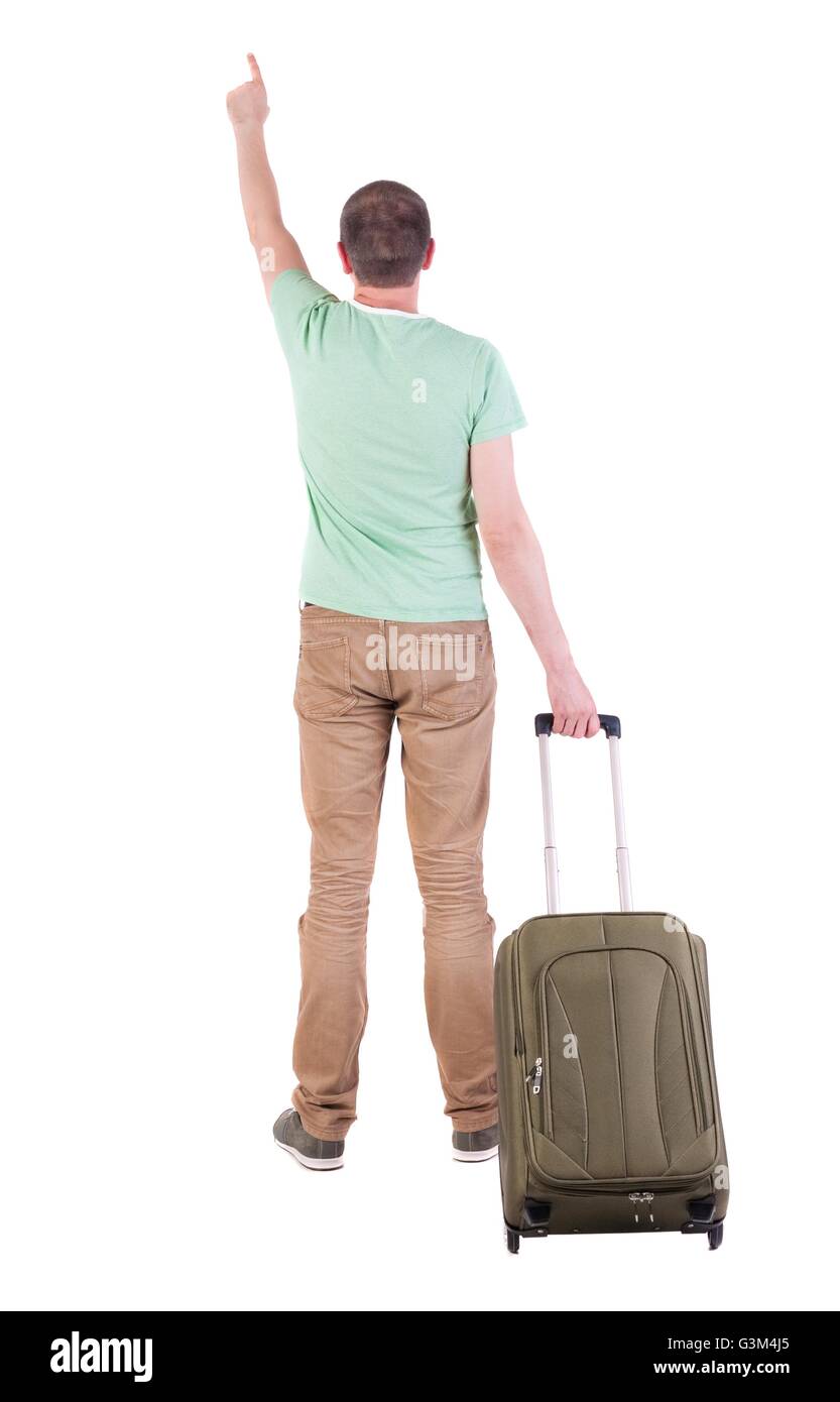 back view of man with suitcase. brunette guy pointing in motion ...