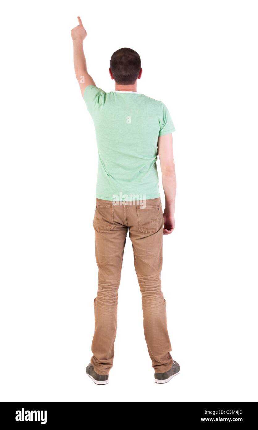 Back view of pointing young men in shirt and jeans. Young guy gesture ...