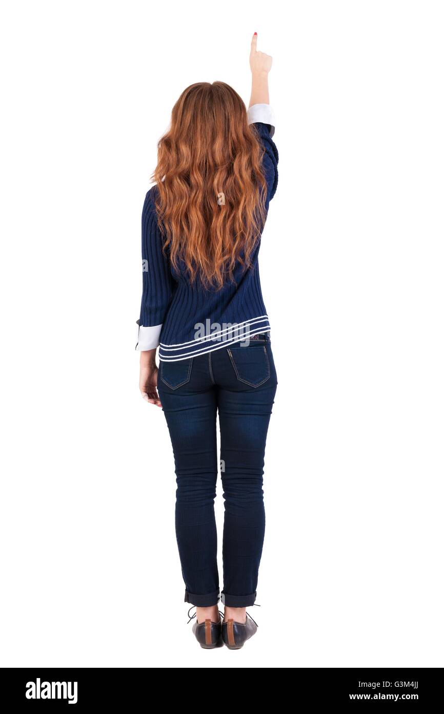 Back view of pointing woman. beautiful redhaired girl . girl shows ...