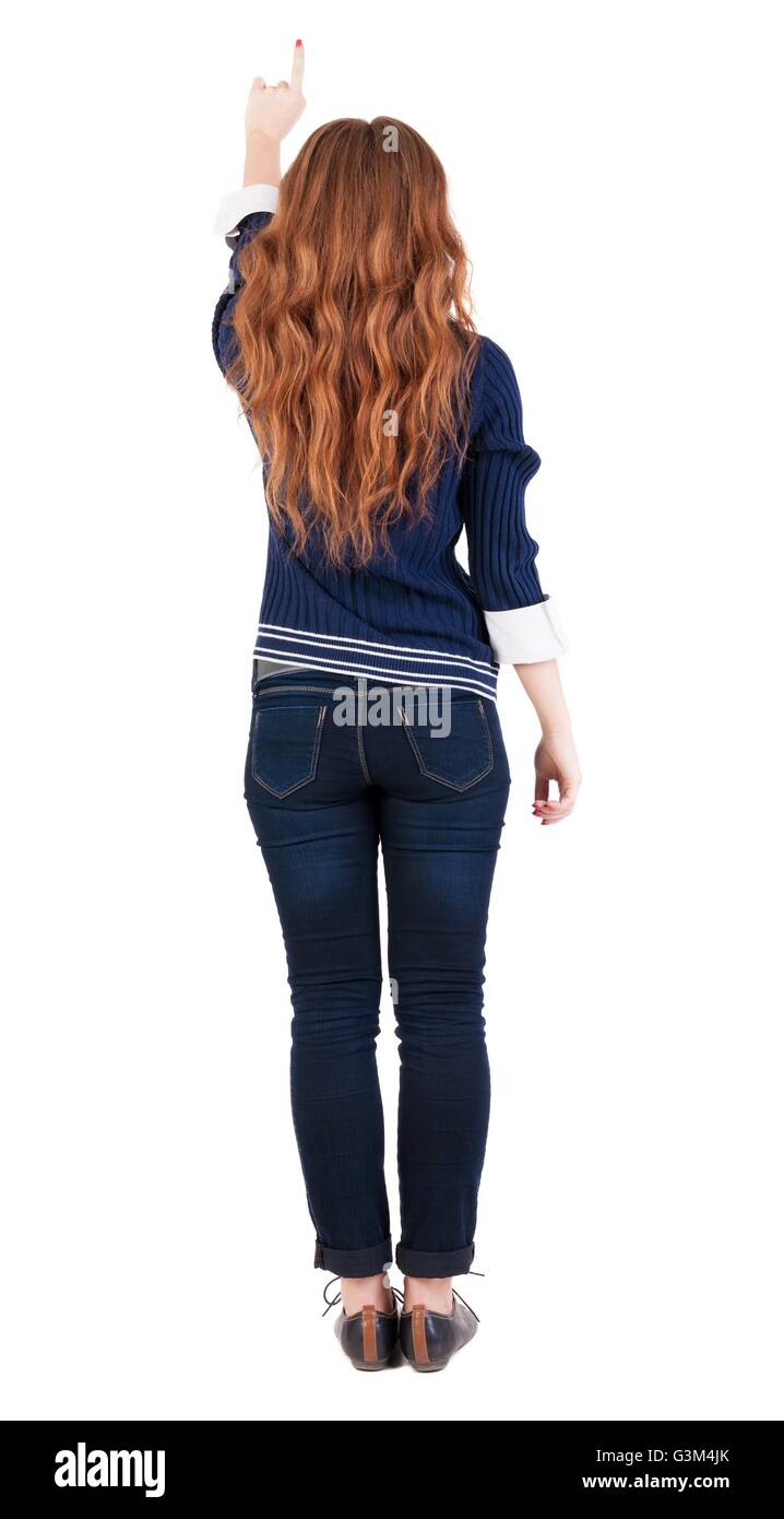 Back view of pointing woman. beautiful redhaired girl . girl shows ...