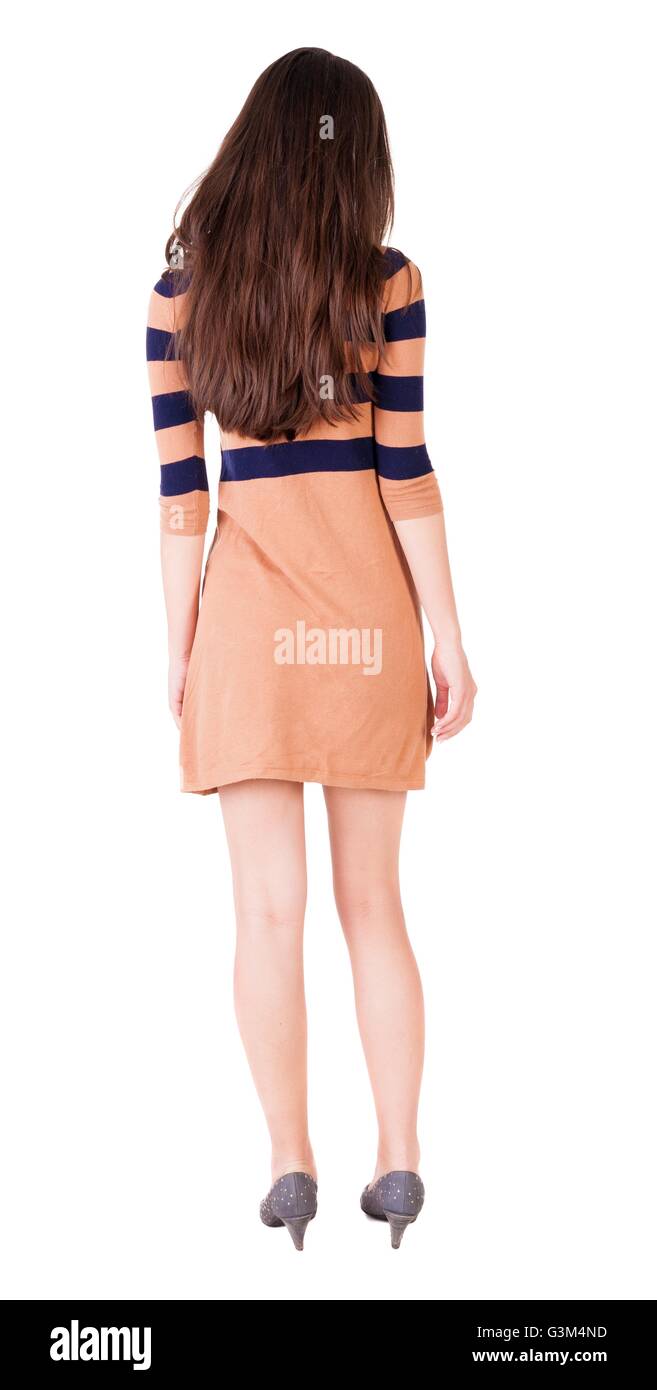 back view of standing young beautiful brunette woman. girl watching ...