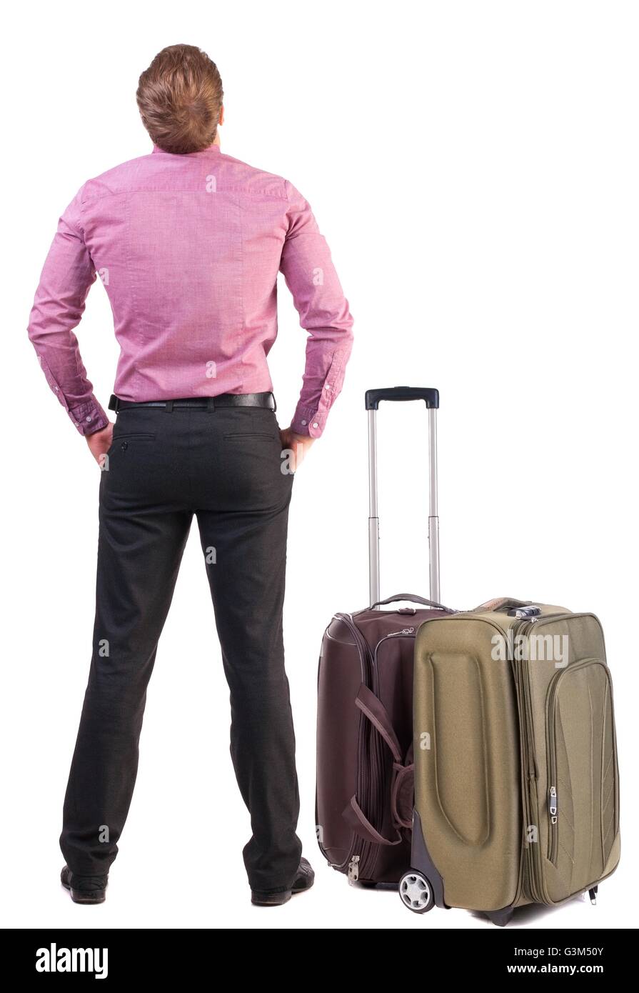 Back view of traveling busness man with suitcase looking up. Standing ...