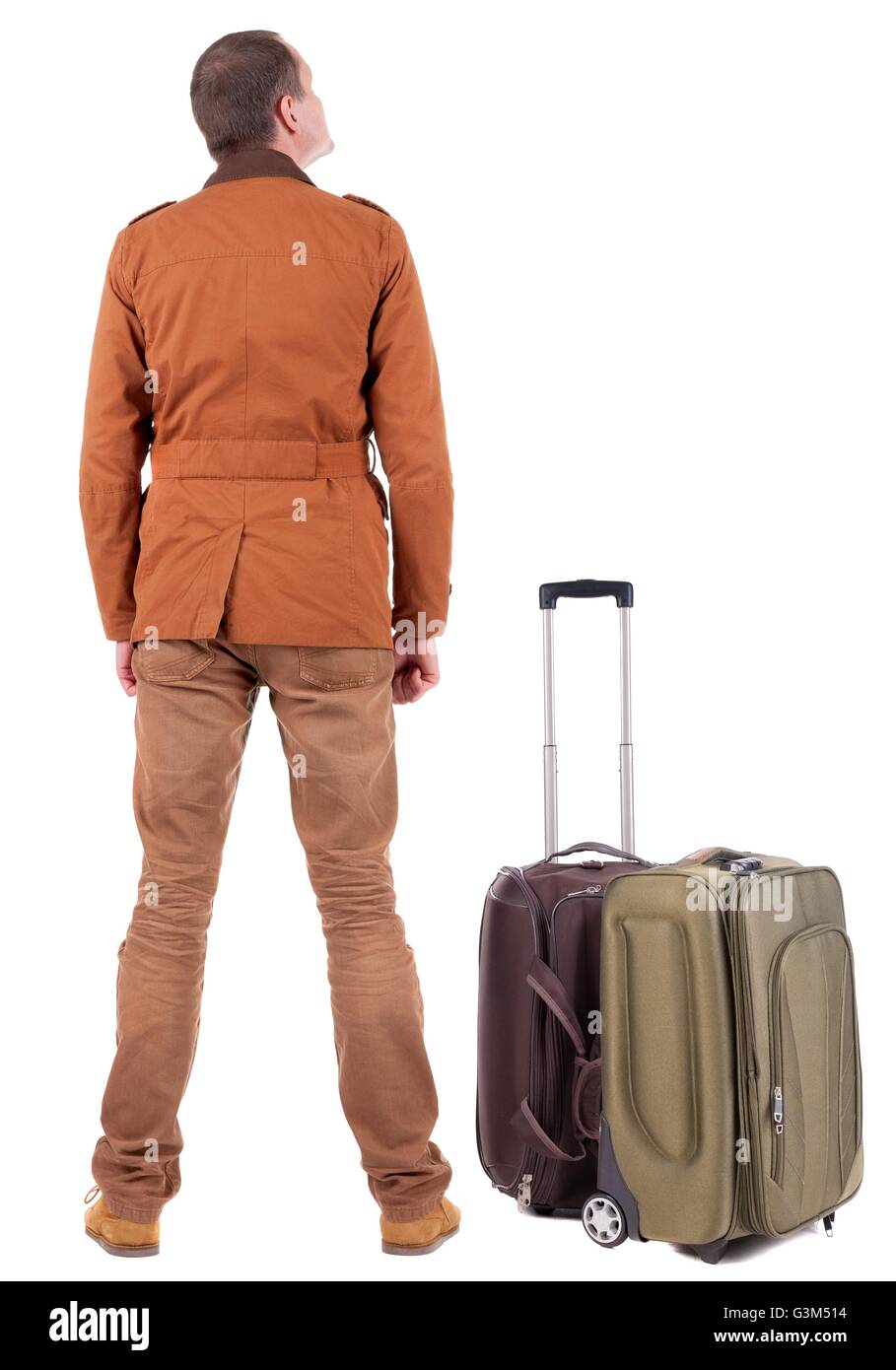 Back view of traveling busness man with suitcase looking up. Standing ...