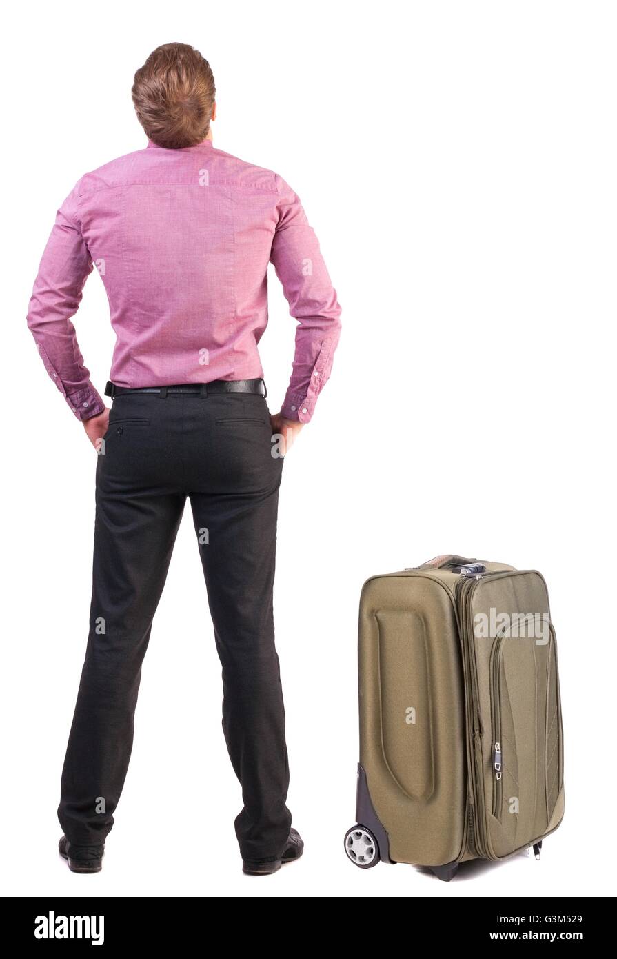 Back view of traveling busness man with suitcase looking up. Standing ...