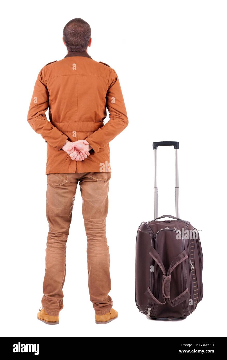 Back view of traveling busness man with suitcase looking up. Standing ...