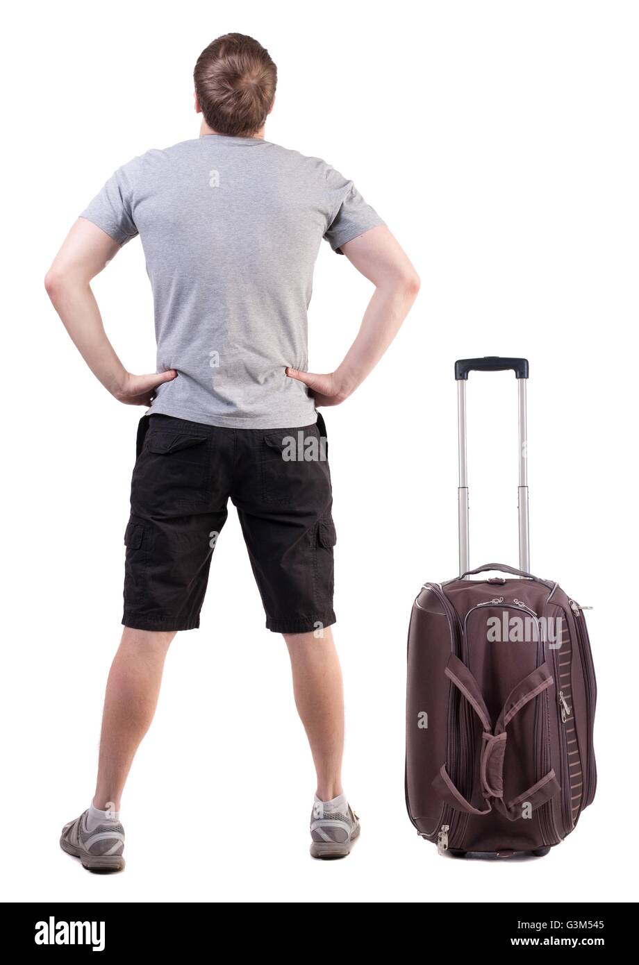 Back view of traveling man with suitcase looking up. Rear view people ...