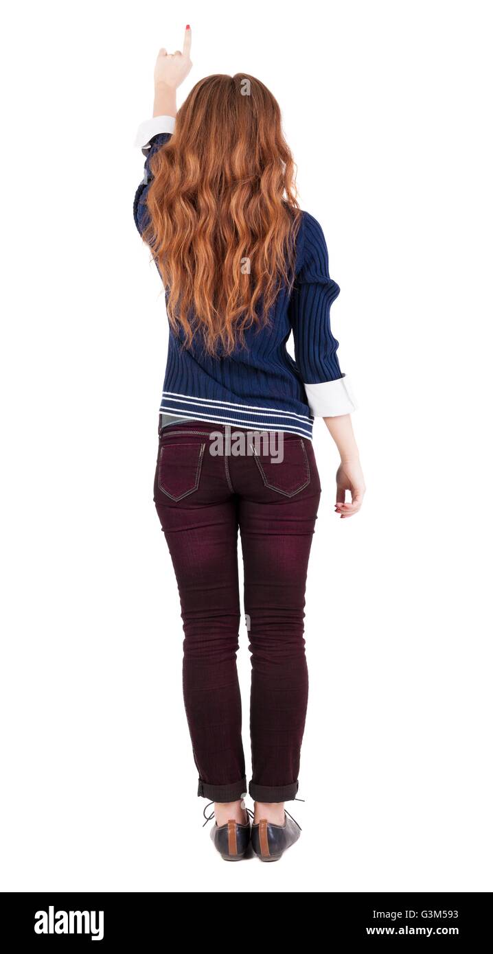 Back view of pointing woman. beautiful redhaired girl . girl shows ...