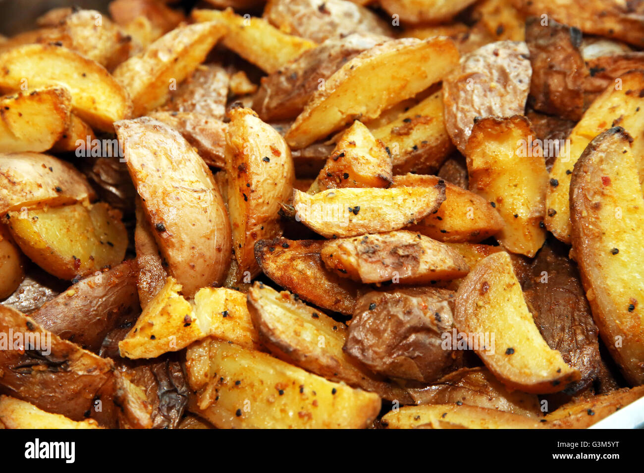 Roasted potatoes ready to eat closeup Stock Photo - Alamy