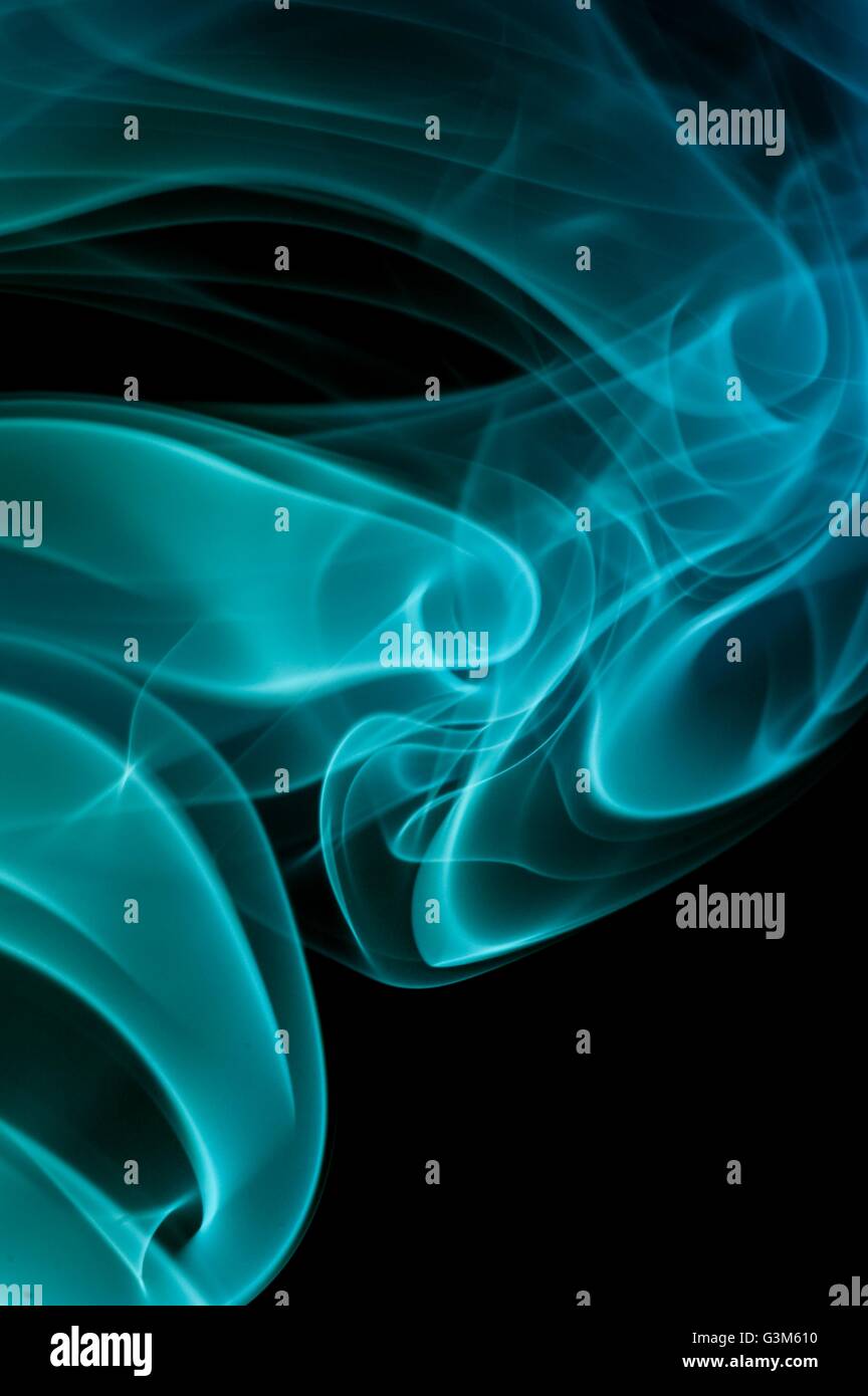Abstract blue smoke over black background Stock Photo - Alamy