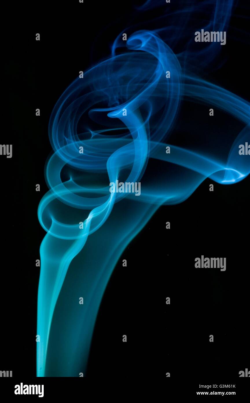 Abstract blue smoke over black background Stock Photo - Alamy