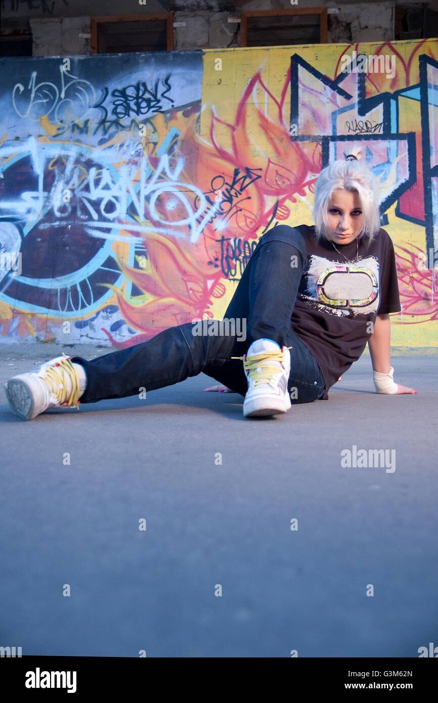Girl break-dancer posing Stock Photo - Alamy