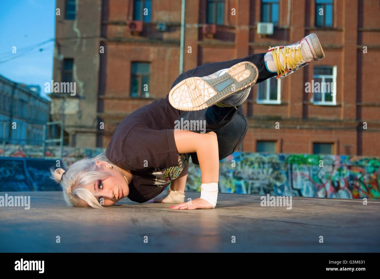 Girl break-dancer posing Stock Photo - Alamy