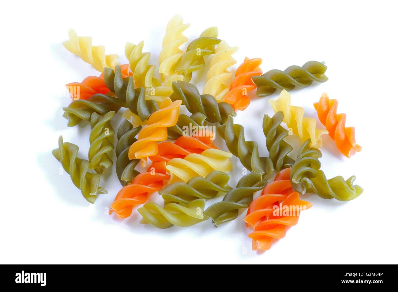 multicolor spiral macaroni. Close up. Isolated over white Stock Photo ...