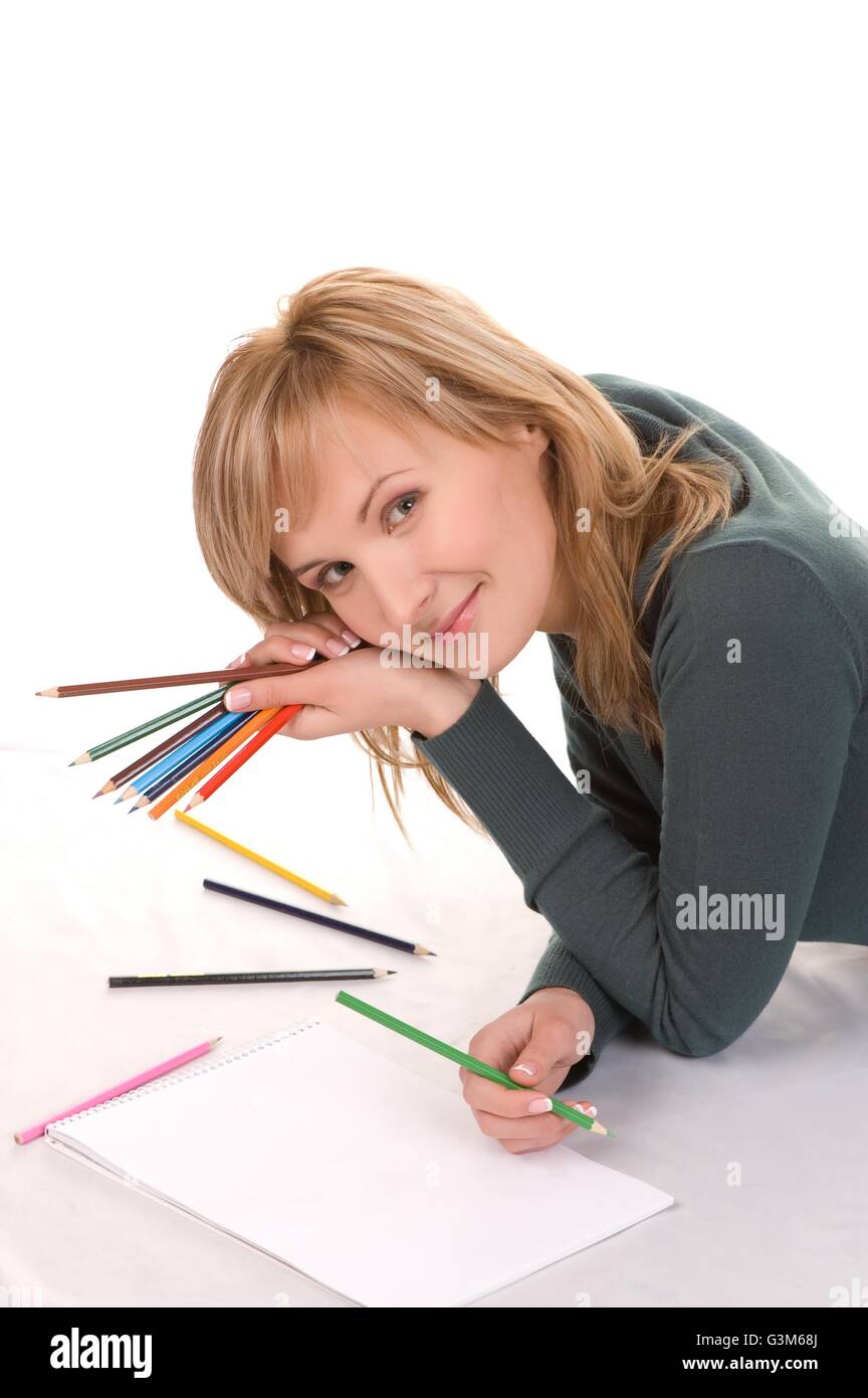Beautiful young woman is going to draw. Isolated over white Stock Photo ...