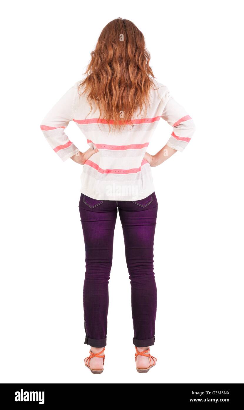 back view of standing young beautiful woman. girl watching. Rear view ...