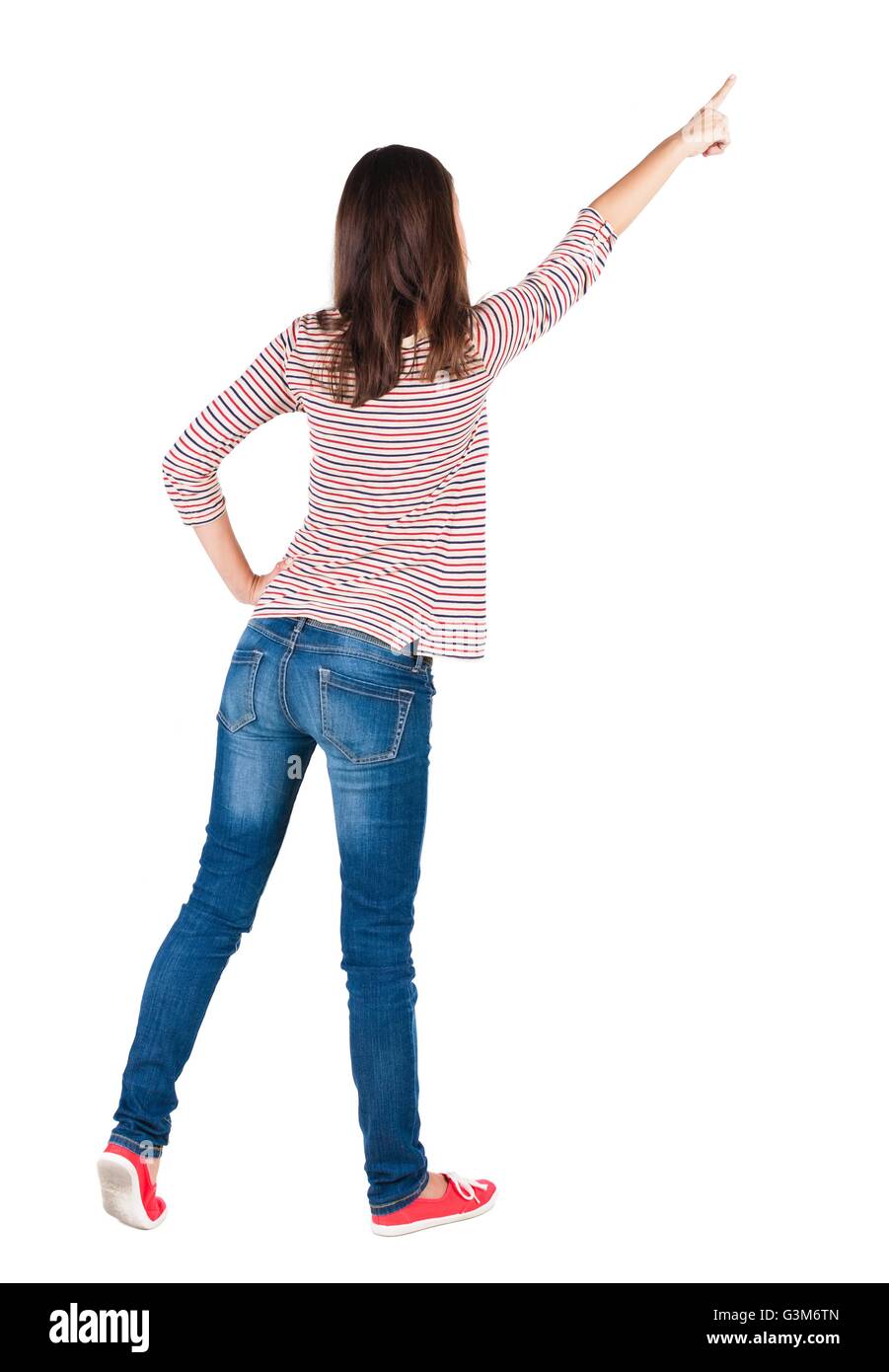 Back view of pointing woman. beautiful brunette girl in jeans. Rear ...