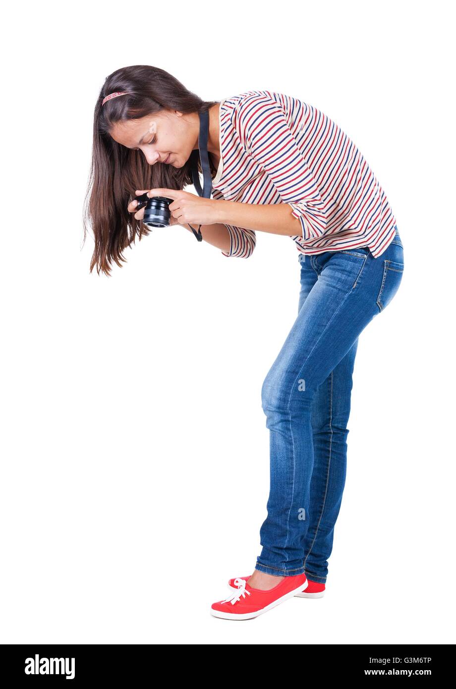 Back view of woman photographing. girl photographer in jeans. Rear view ...
