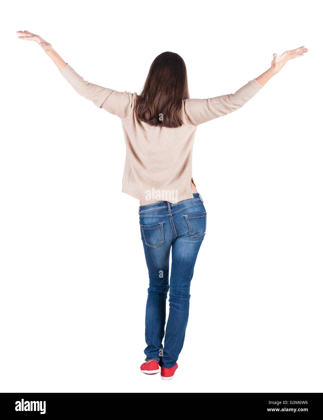 back view of dancing young beautiful brunette woman. girl watching ...