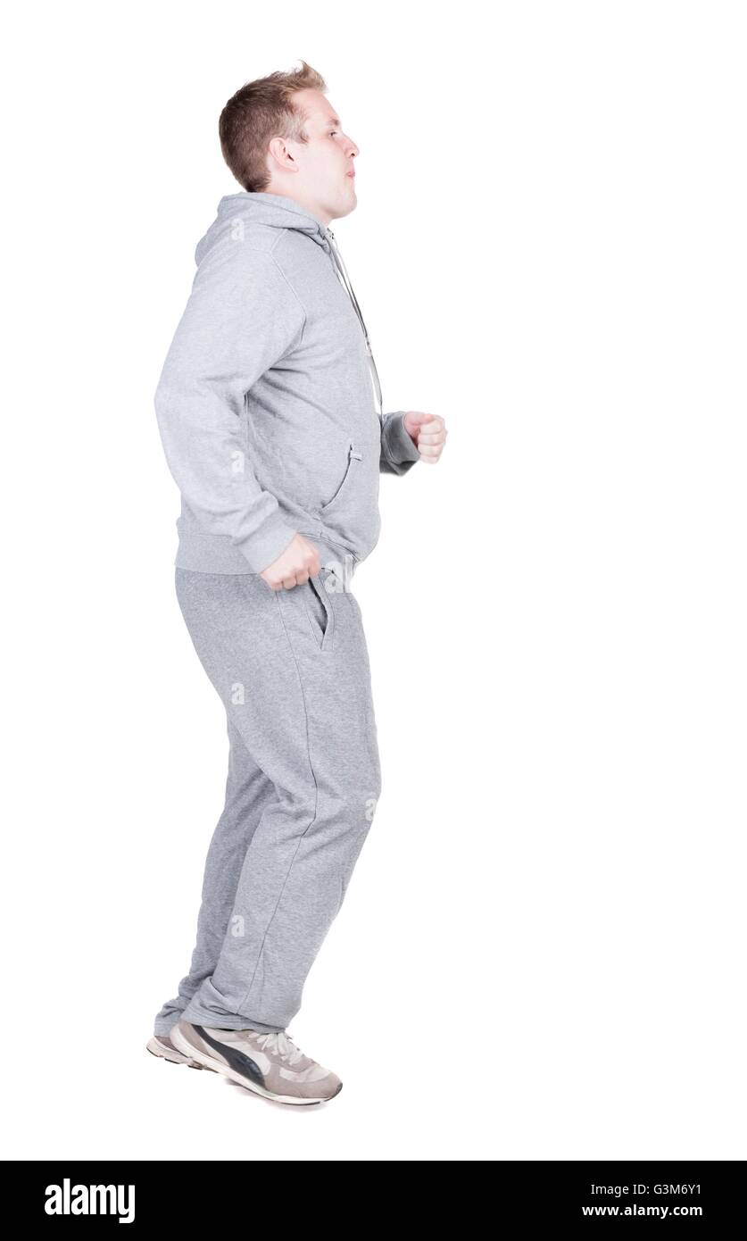 back view of running athlete man in tracksiut . walking sportsman in ...