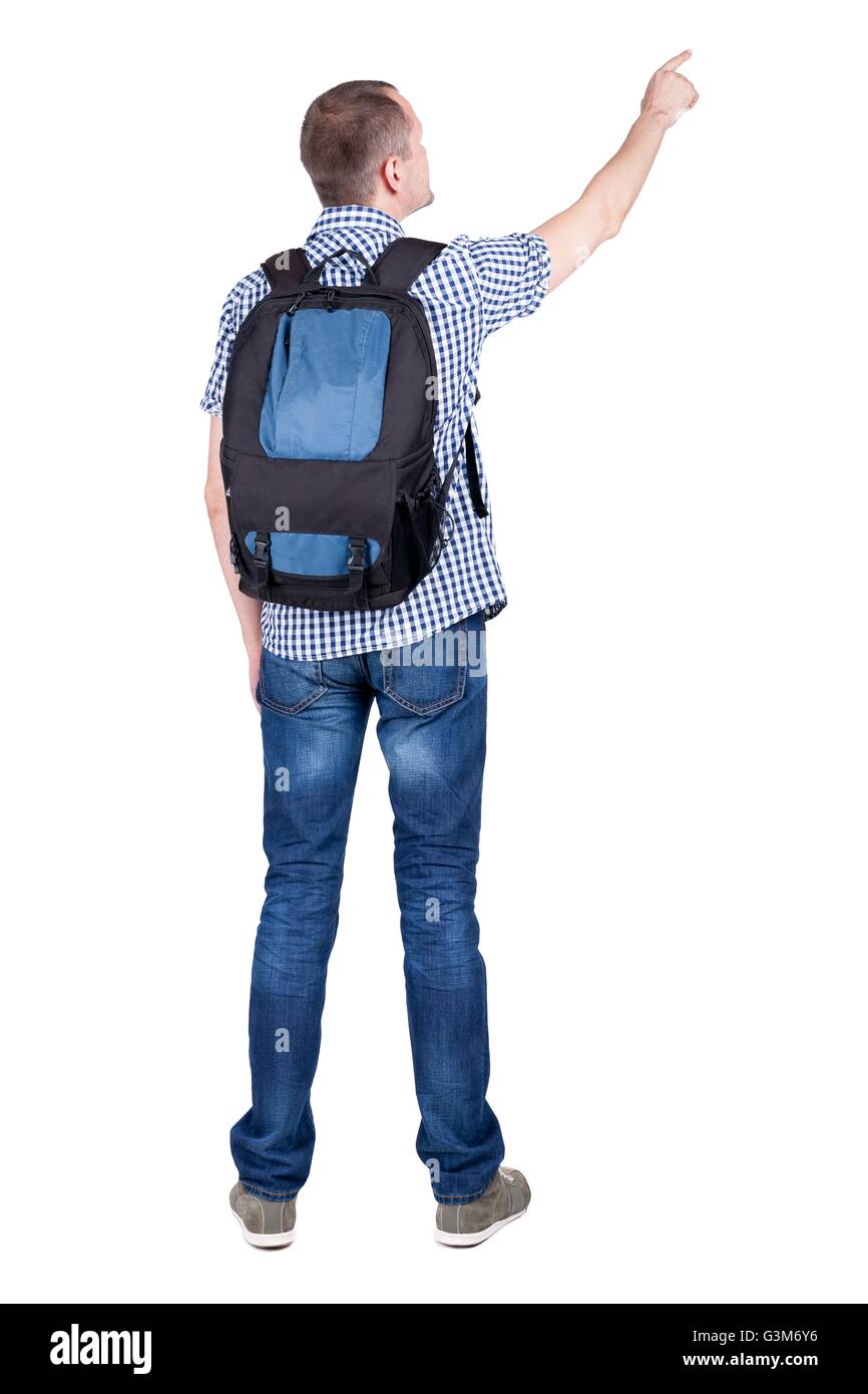 Back view of pointing man with backpack looking up. Standing young guy ...