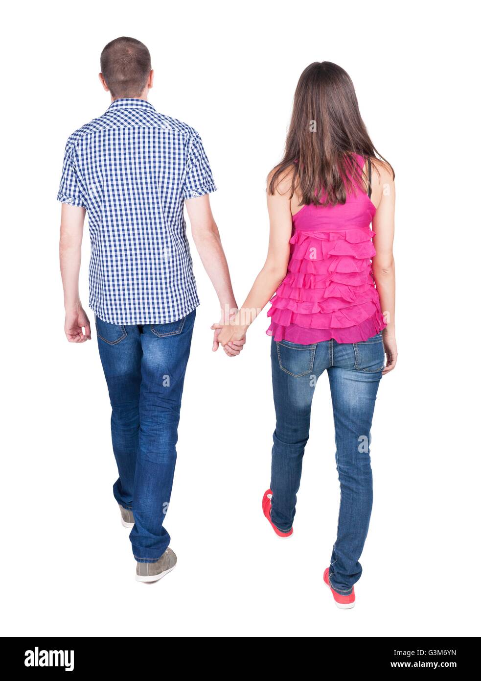 Back view of going young couple (man and woman). walking beautiful ...