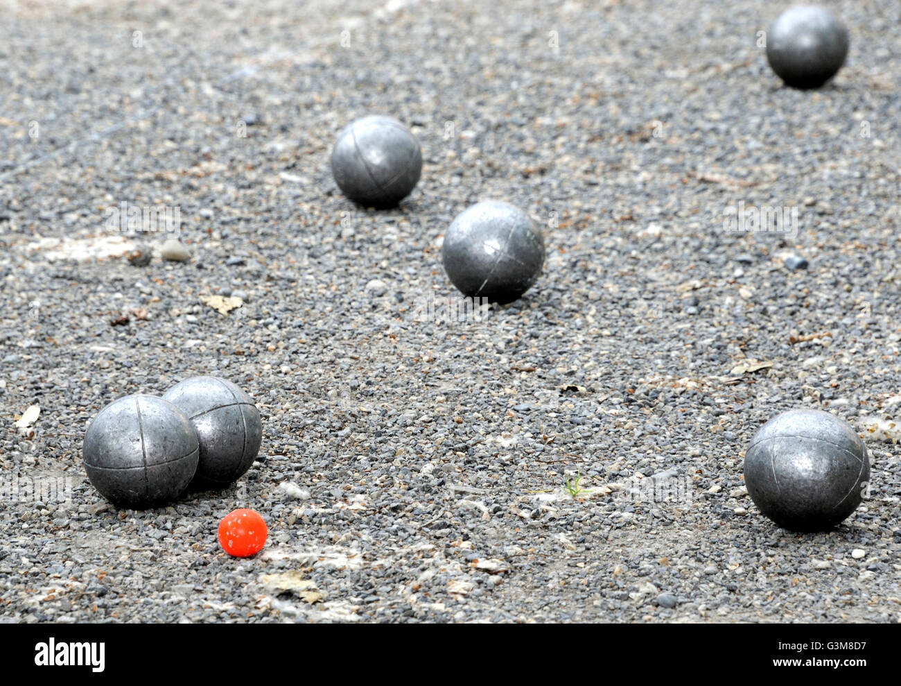 Playing jeu de boules or also called petanque in France. This play is ...