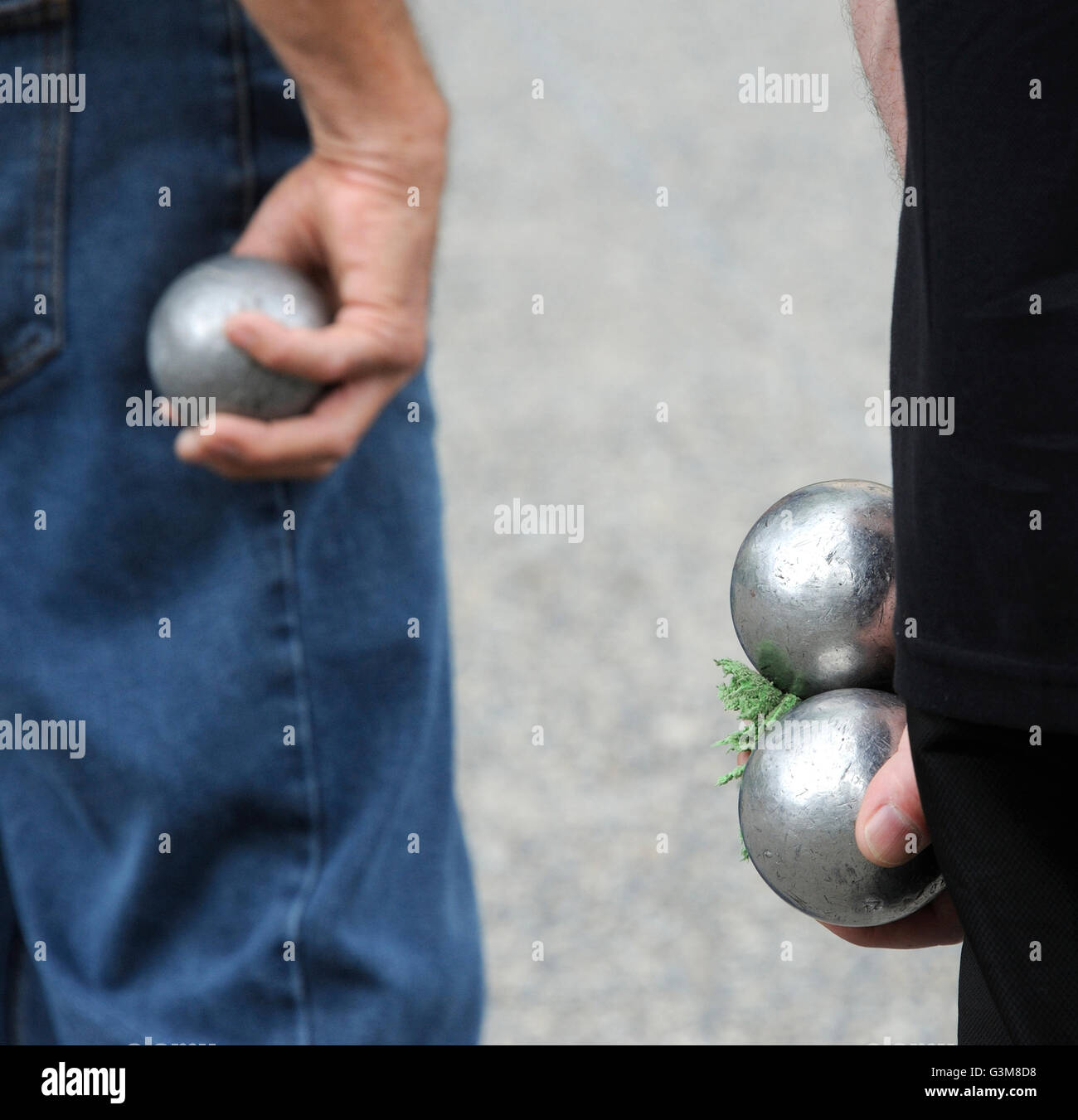 Playing jeu de boules also called petanque in France. This play is ...